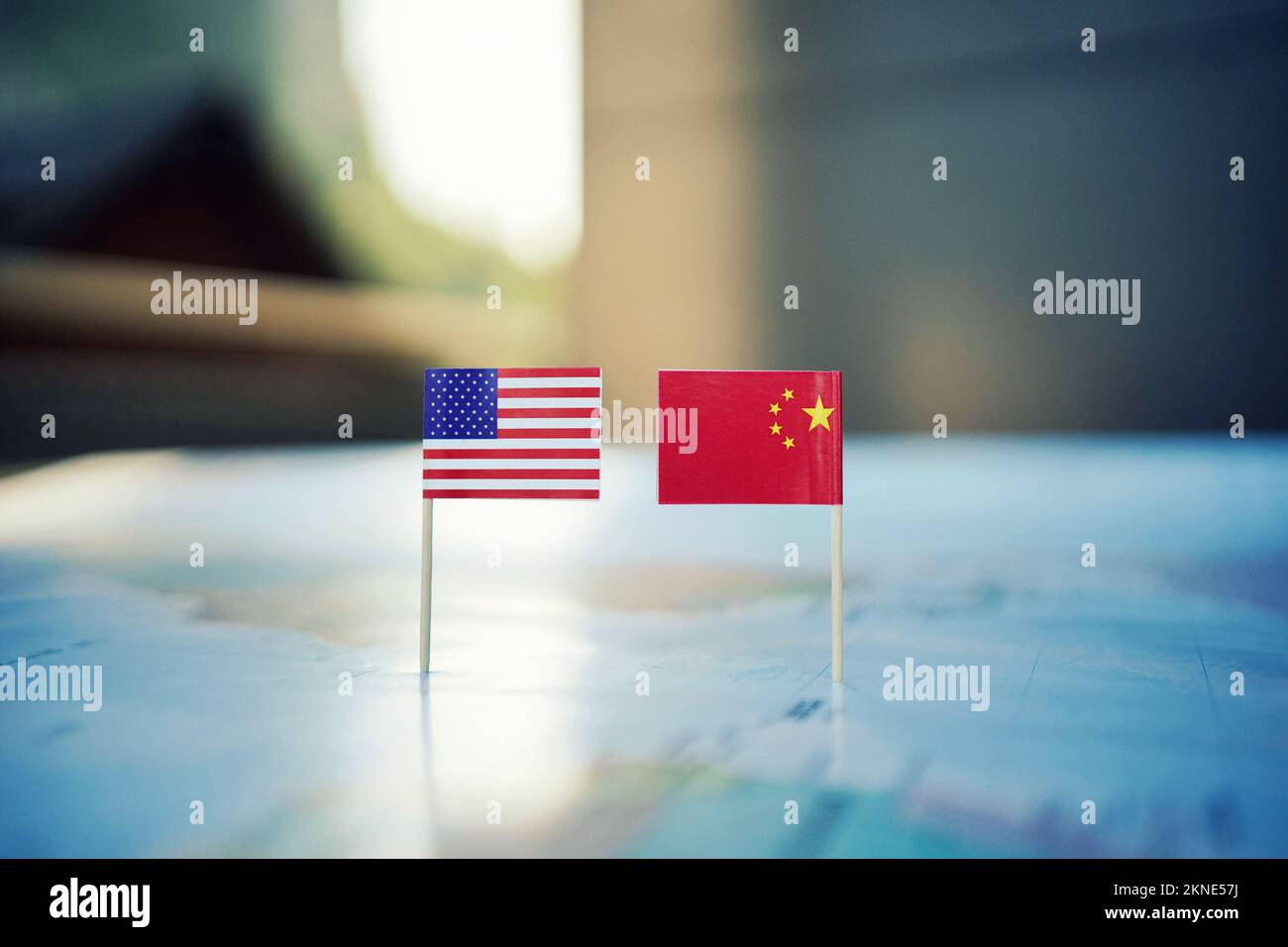 Small flags of USA and China on a world map representing bilateral ...