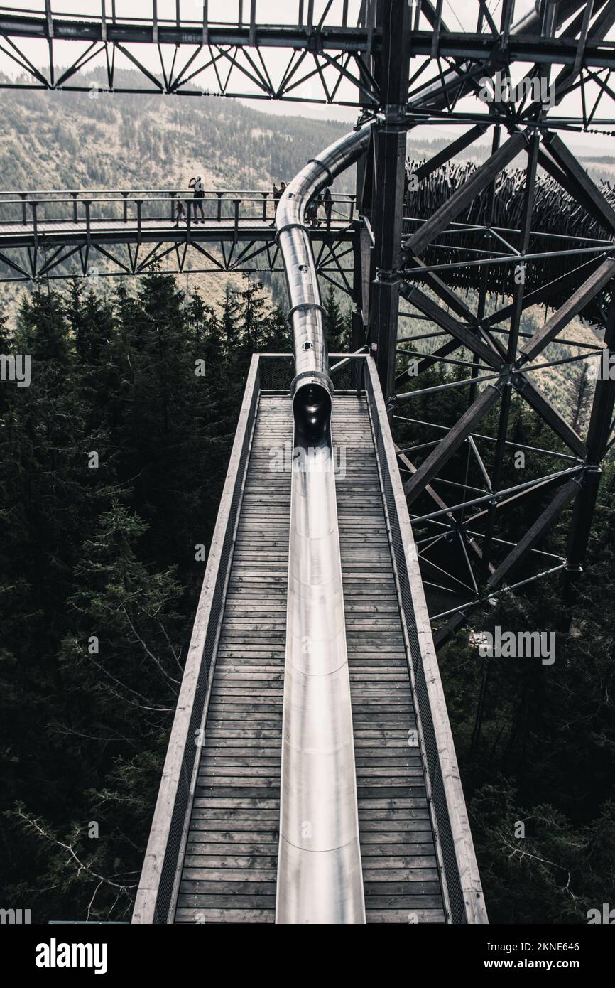 A vertical high-angle shot of a skywalk with a slide Stock Photo - Alamy