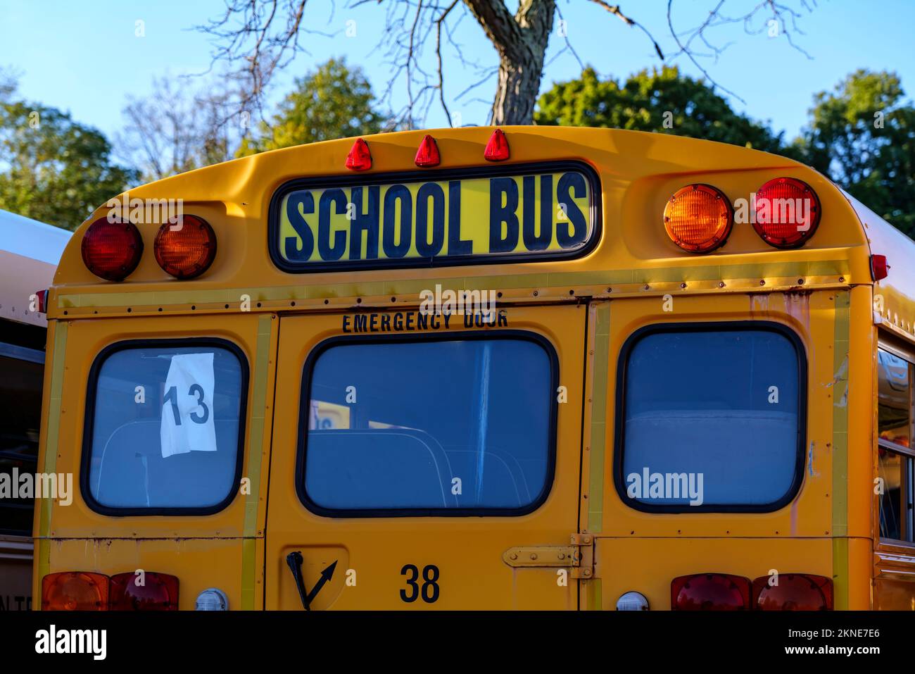 Top of a yellow school bus with lights and text. Back to school concept ...