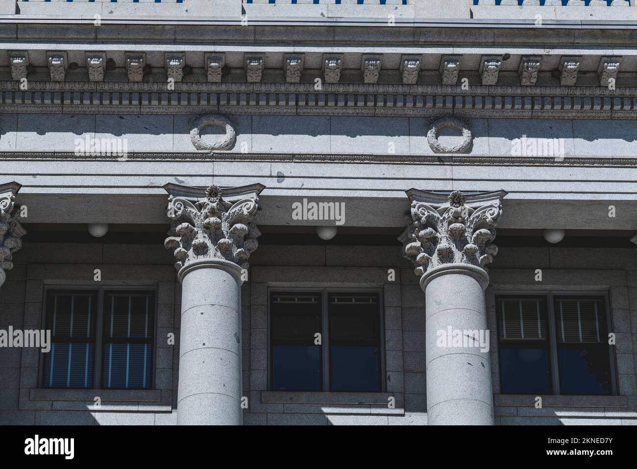 The architecture of buildings windows, stucco molding, and columns on a ...