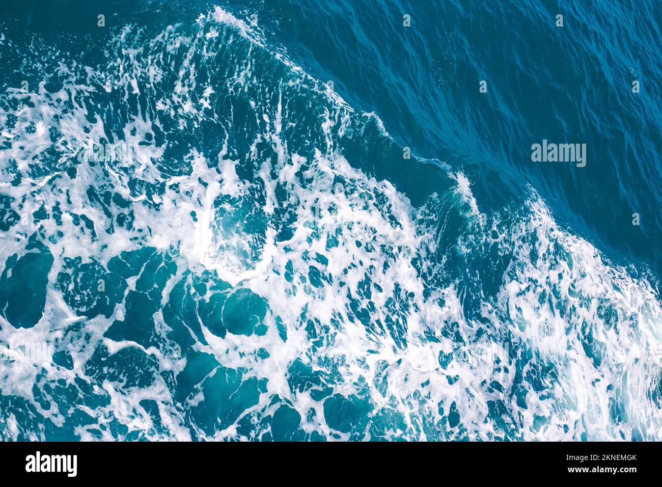 Blue sea water with waves and foam, top view. Water surface, background ...