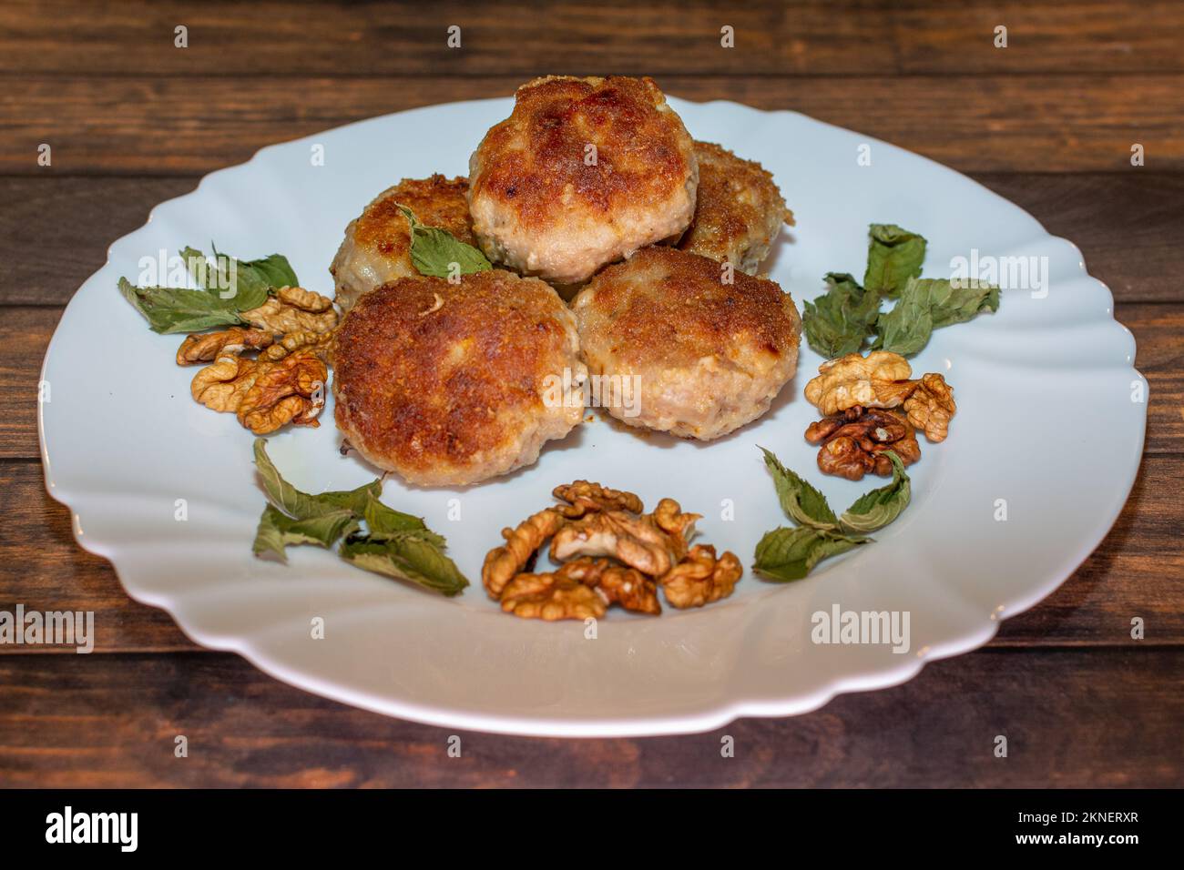 Minced pork chops fried in a pan Stock Photo - Alamy