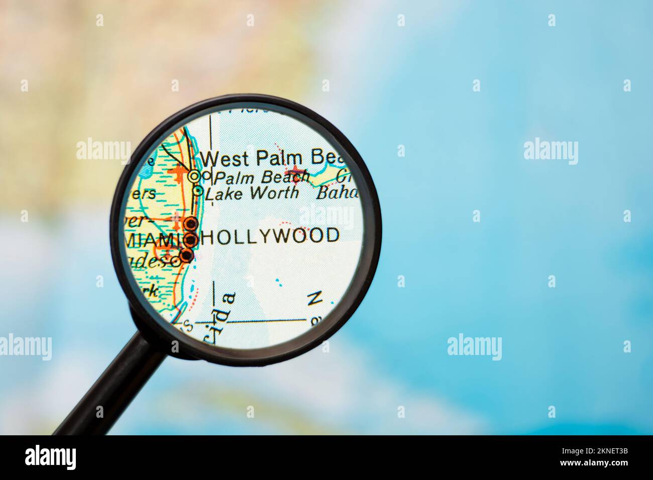 map under magnifying glass - Hollywood Stock Photo - Alamy
