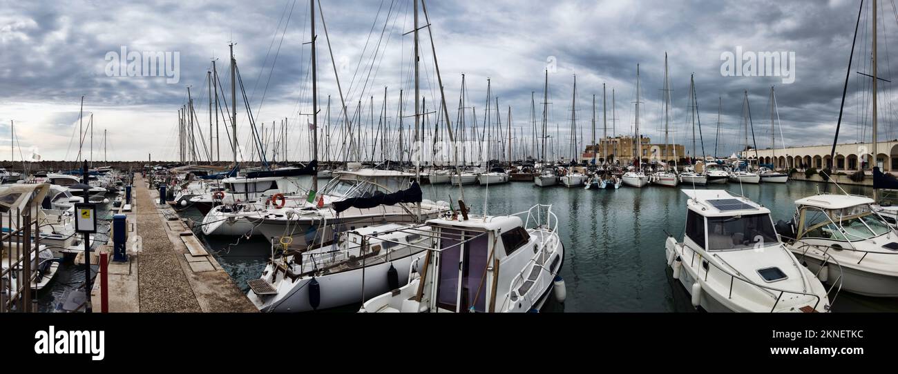 Harbor skyline with many sail boats and its sail masts at horizon with ...