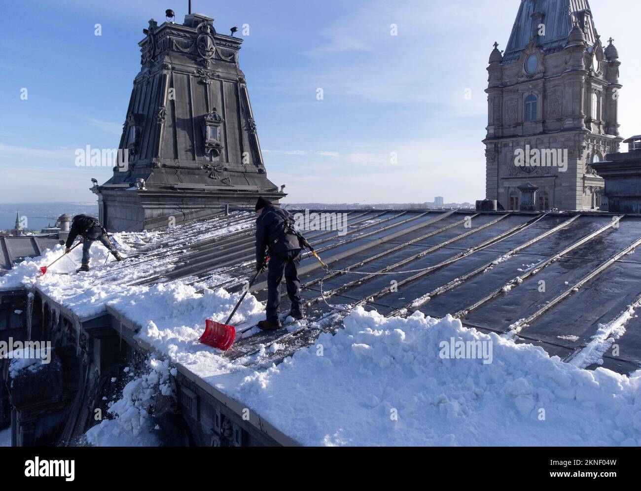 A crew shovels the roof of the National Assembly, Sunday, November 27 ...