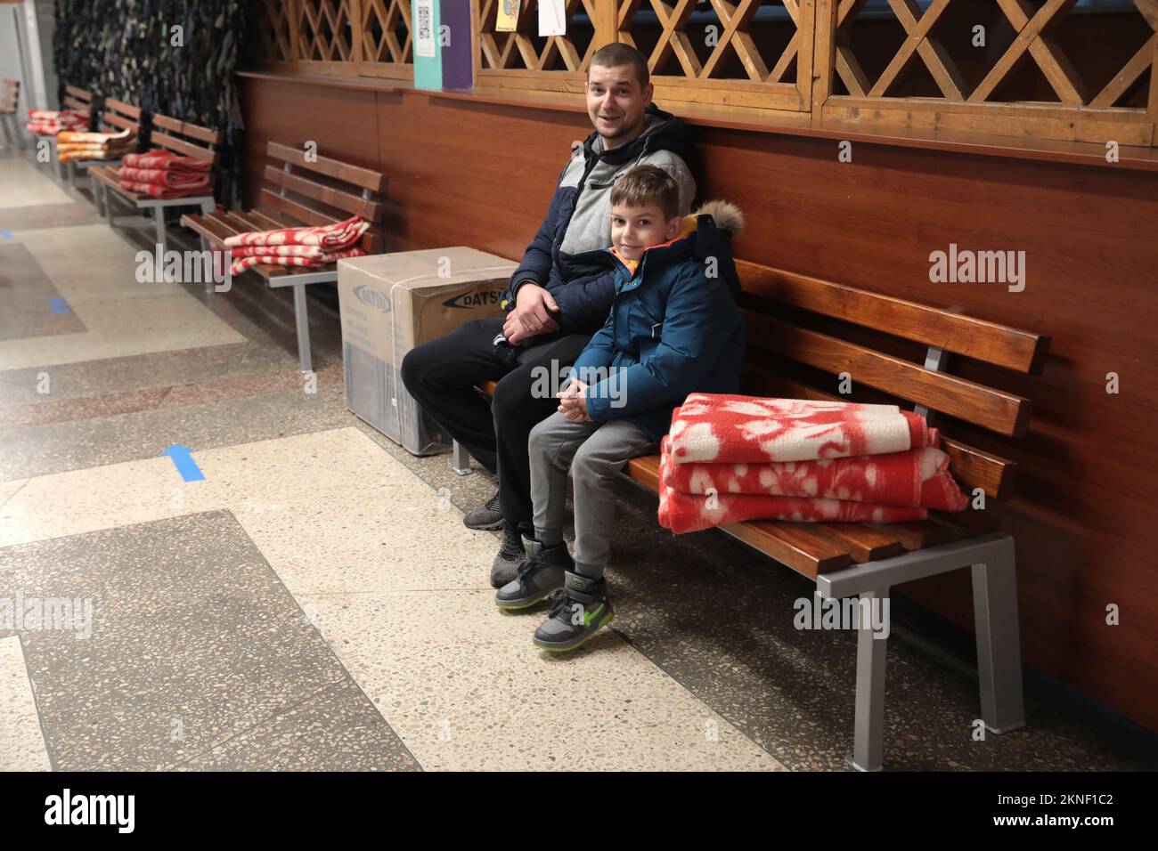 Non Exclusive: KYIV, UKRAINE - NOVEMBER 26, 2022 - A man and a boy sit ...