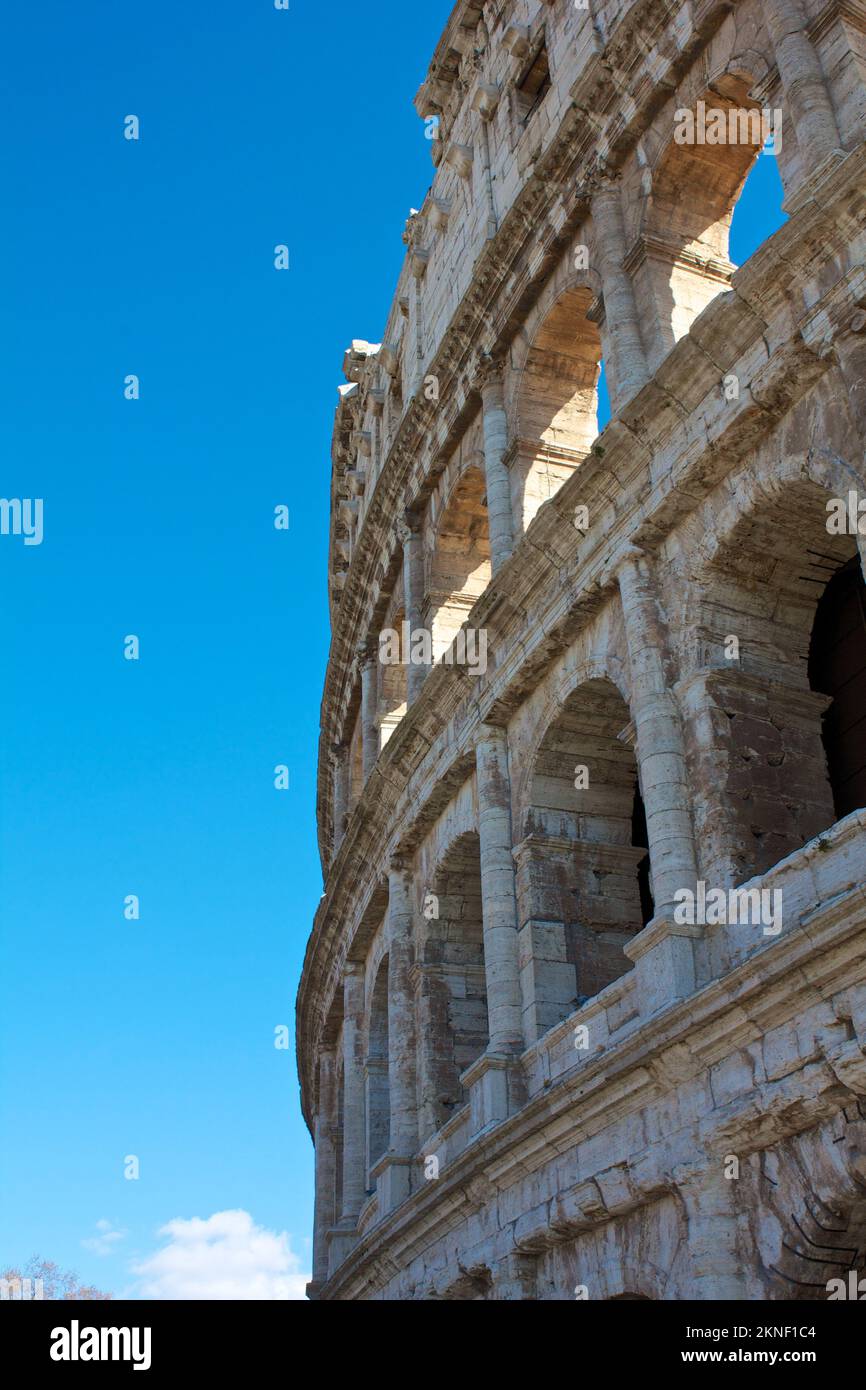 A vertical shot of the facade of the Colosseum in Rome, Italy under the ...