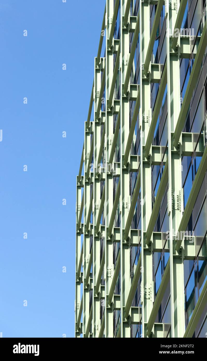 abstract lattice of green metal Assembly building on the river side in ...