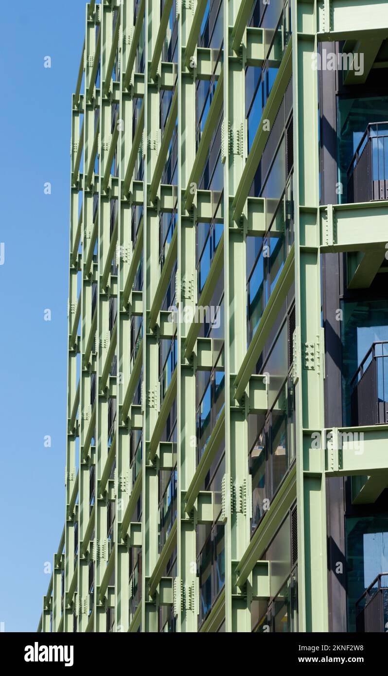 abstract lattice of green metal Assembly building on the river side in ...