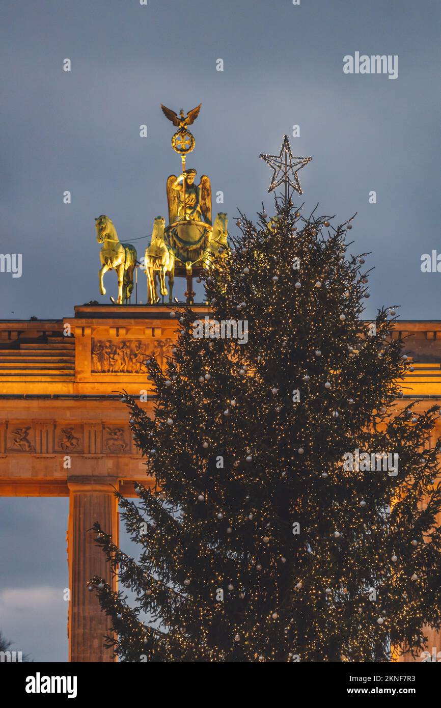 A vertical shot of Brandenburger Gate with a Christmas tree. Berlin ...