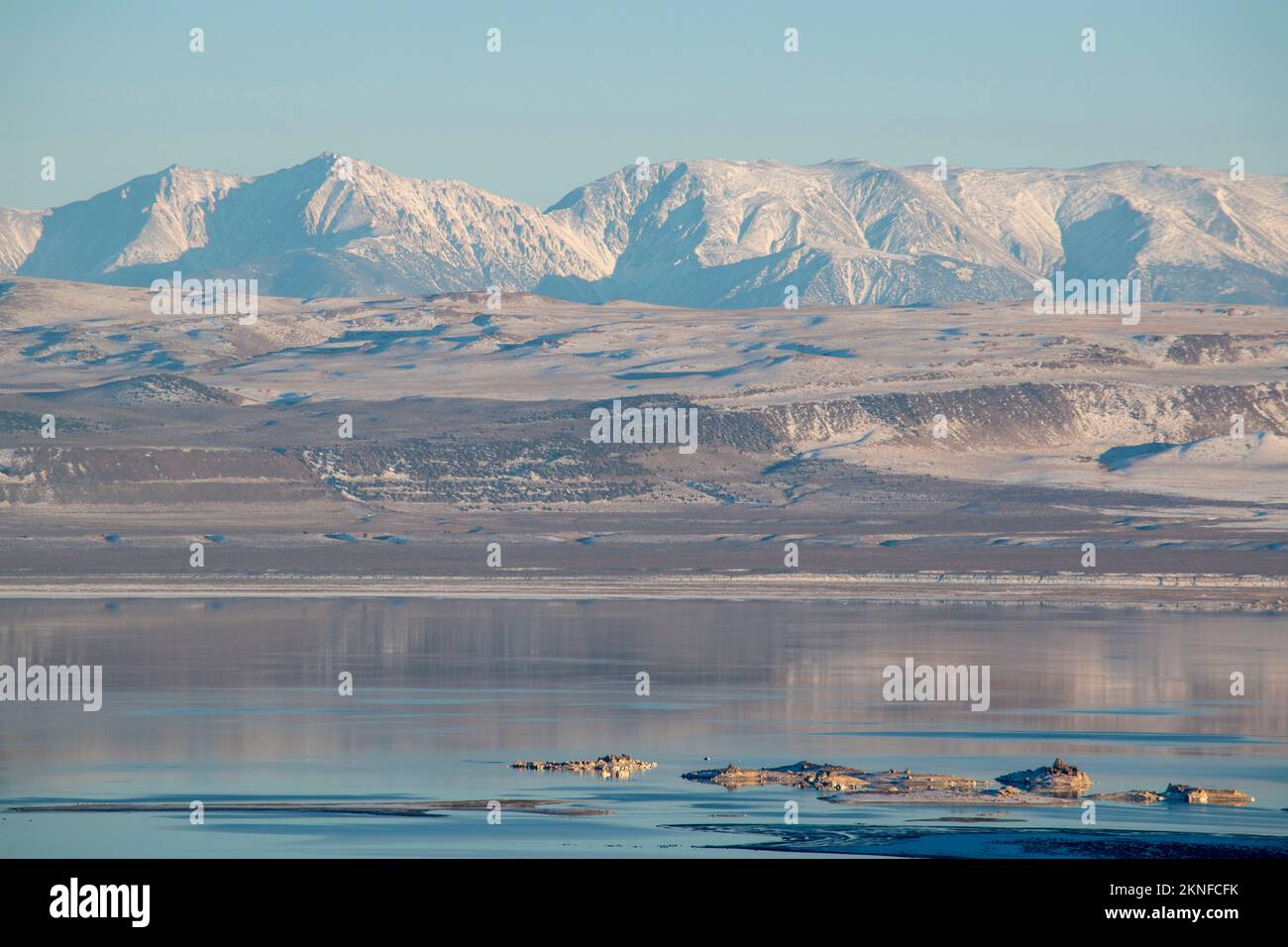 Mono Lake is beautiful in the winter and it reflects mountain peaks ...