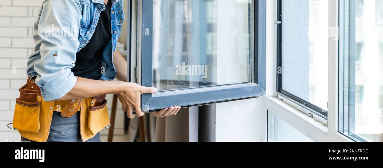 Construction Worker Installing New Windows In House Stock Photo - Alamy
