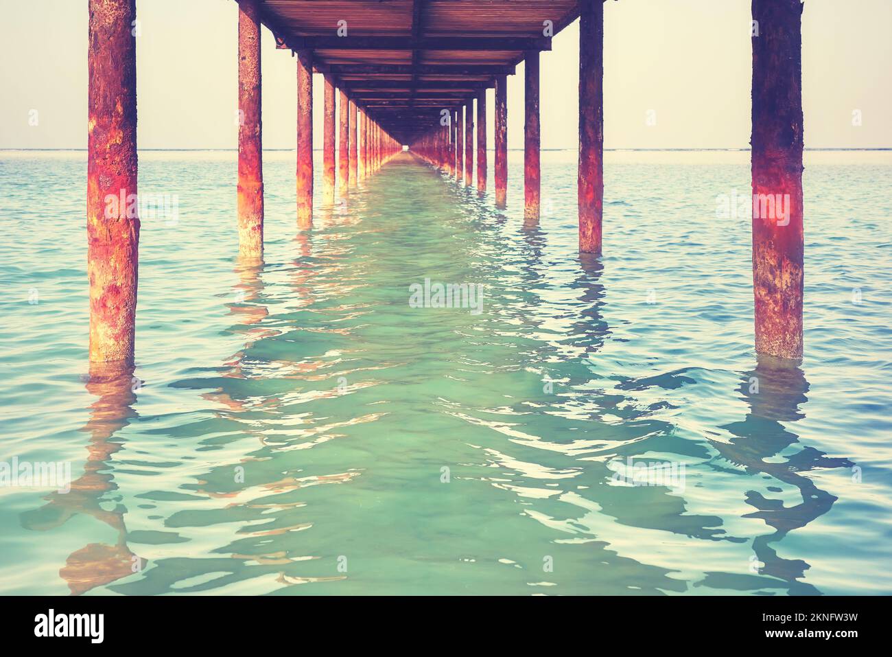 Under a wooden pier, front focus, retro color toning applied Stock ...