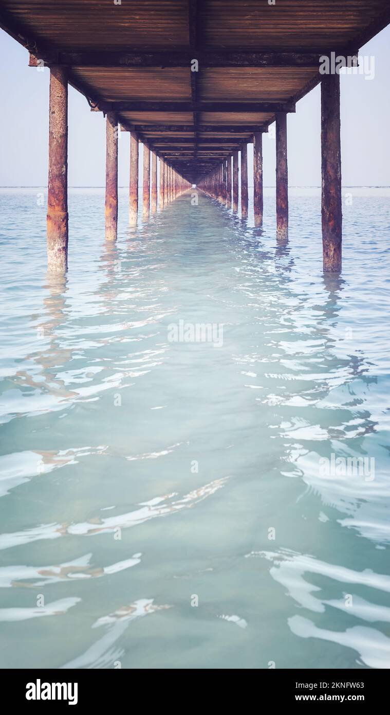 Under a wooden pier, retro color toning applied Stock Photo - Alamy