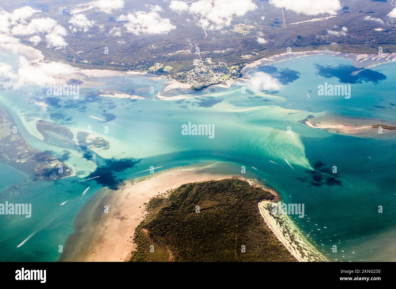 Vibrant aqua blue and green sea landscape with elevated aerial view of ...
