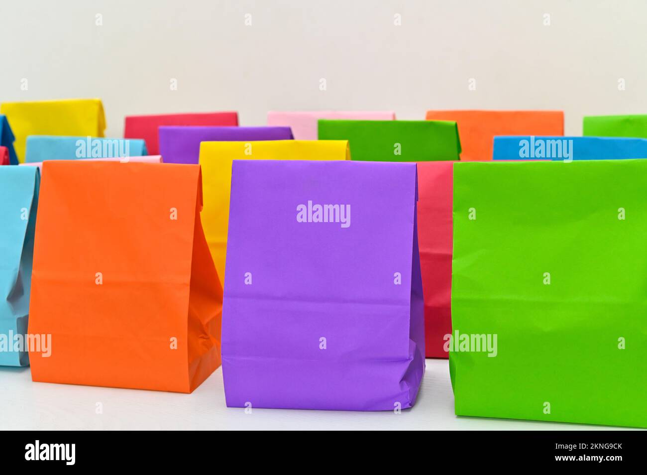 Set of colorful shopping folded paper bags on white background. Paper ...