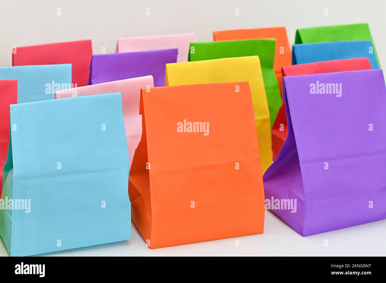 Set of colorful shopping folded paper bags on white background. Paper ...