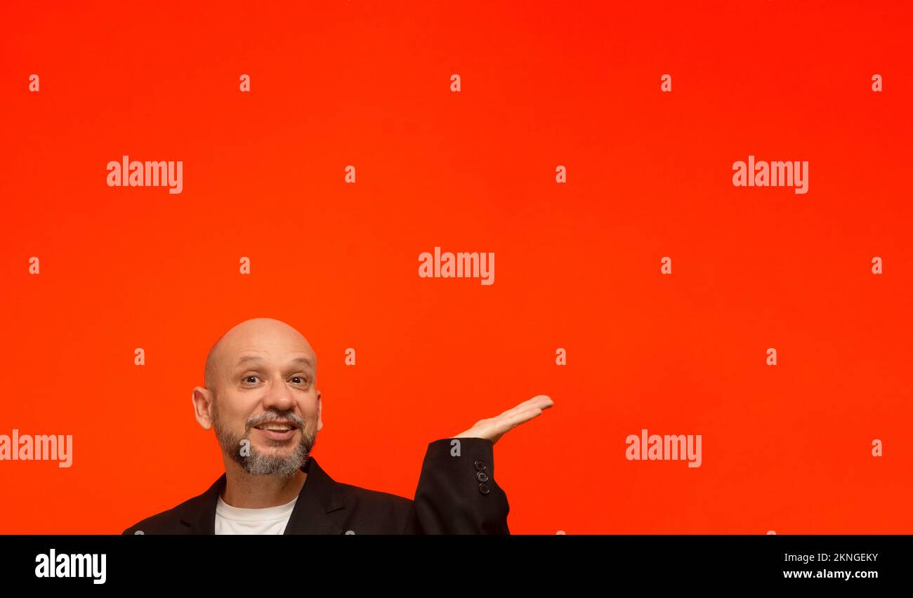 Portrait of a stylish business man making hand gestures. Looking at the ...
