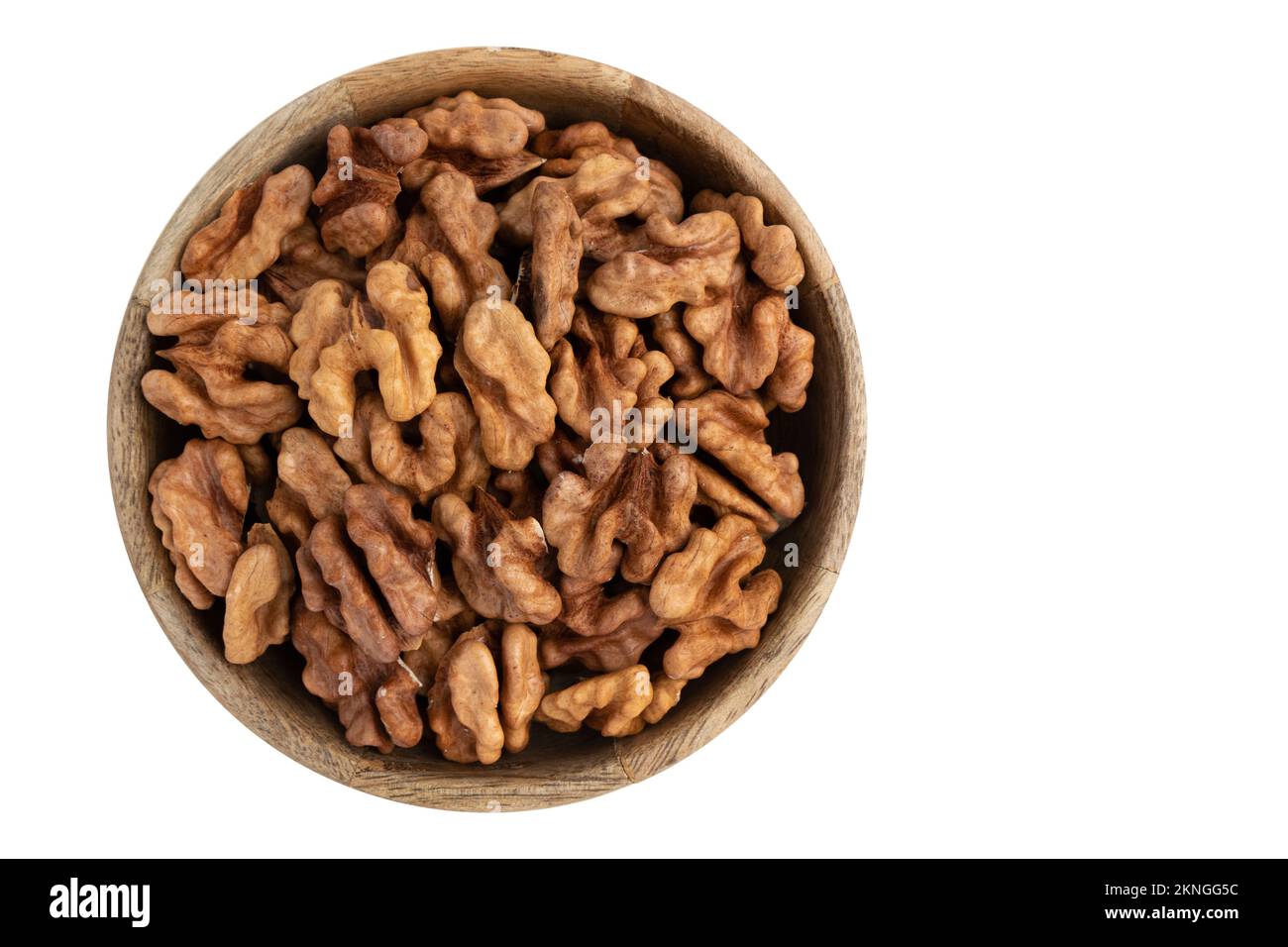 peeled walnuts in wooden bowl isolated on white background, vegetarian ...