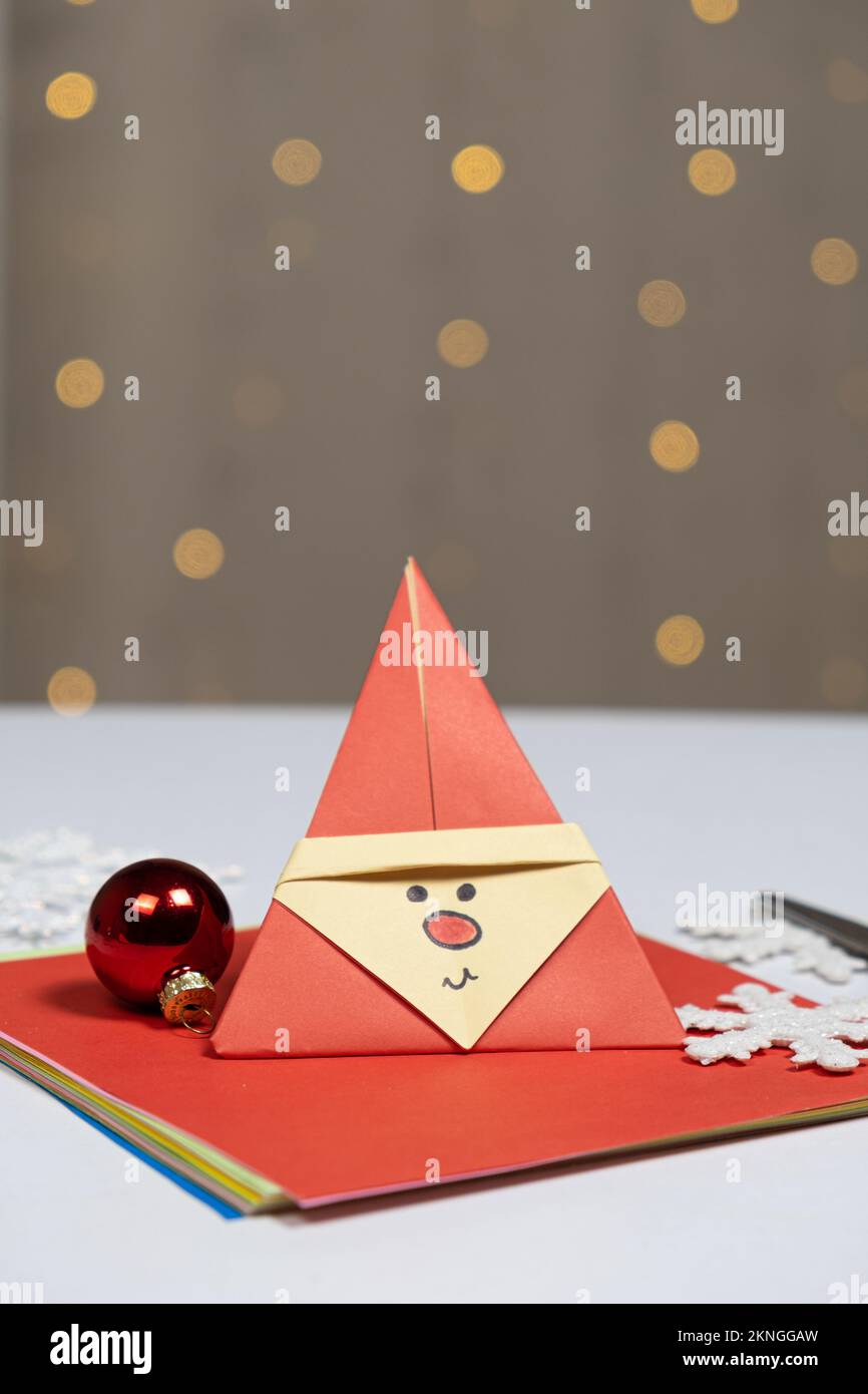 Creation of origami crafts from paper for Christmas and New Year ...