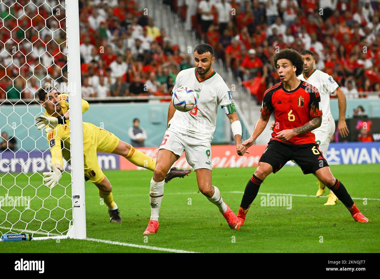 Thibaut Courtois of Belgium and Romain Saiss of Morocco during Belgium ...
