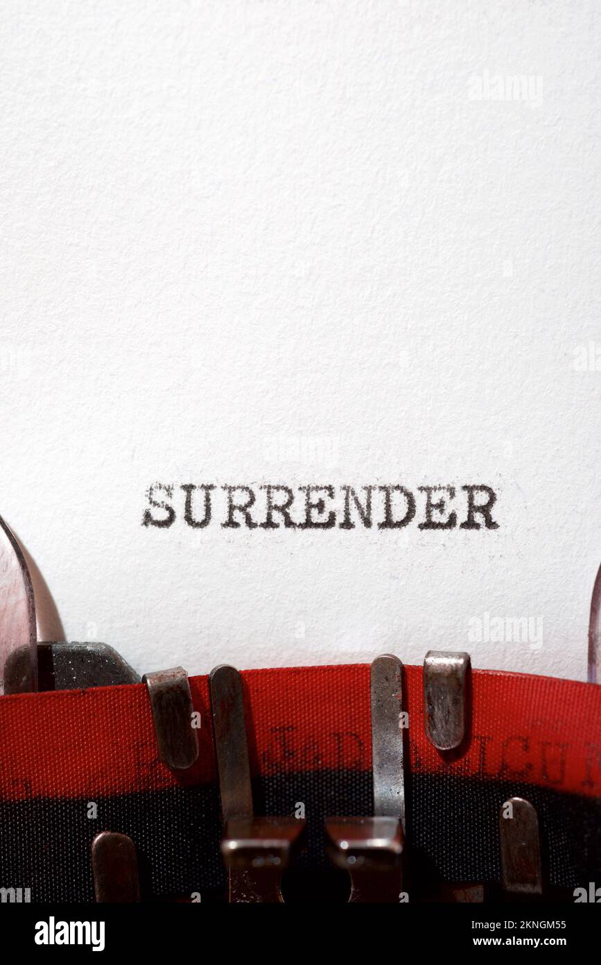 Surrender text written with a typewriter Stock Photo - Alamy