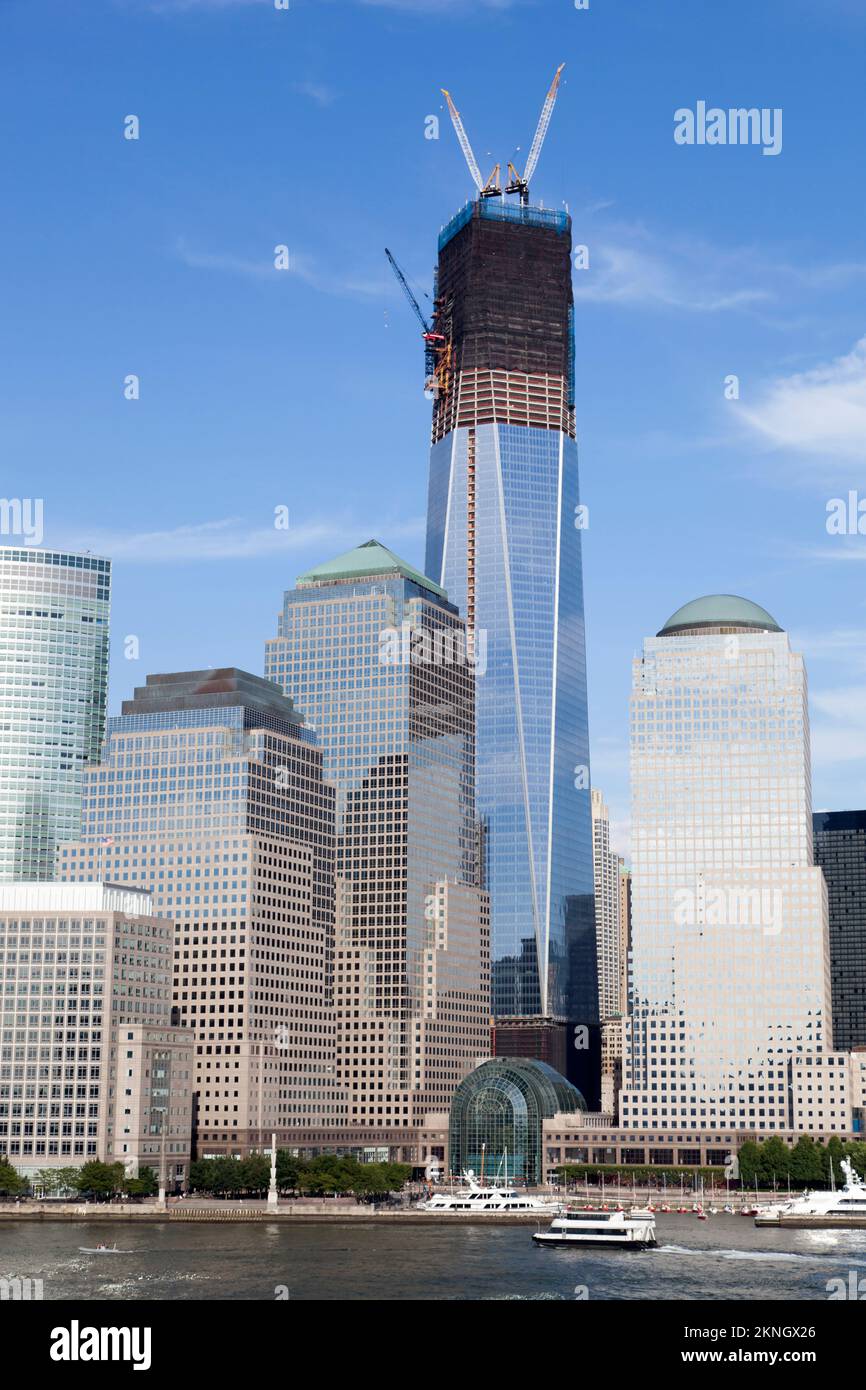 The ferry boat passing along Lower Manhattan waterfront in New York ...