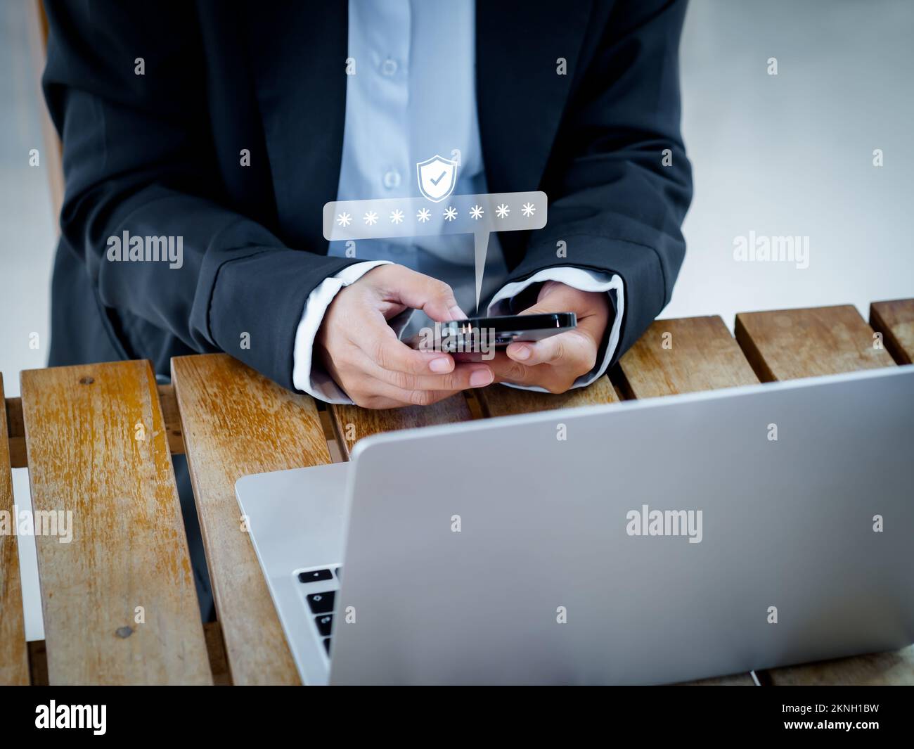 Multi factor authentication concept. Virtual safety shield icon while access on phone with ...