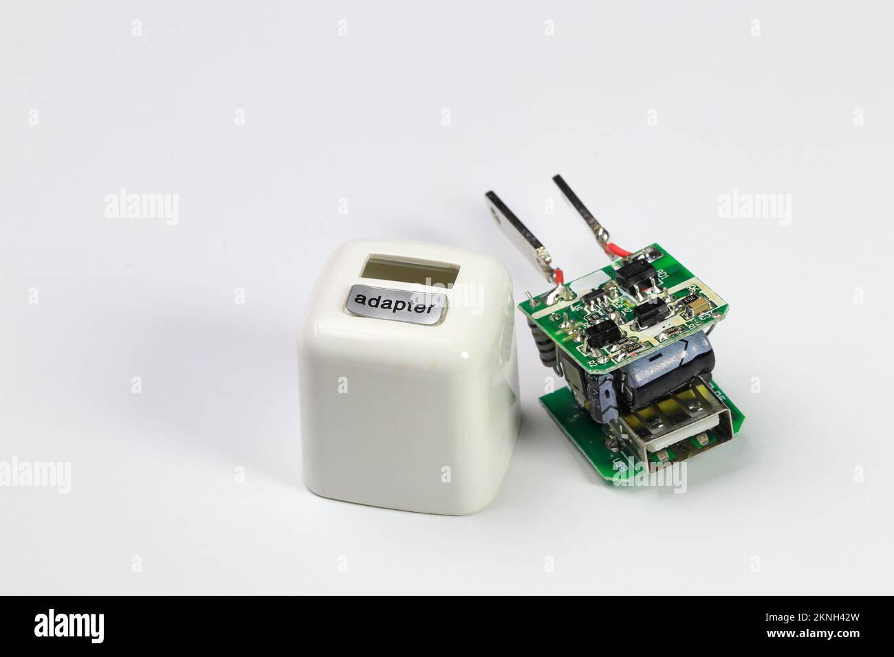 inside of usb charger adapter on white background, broken Charger ...