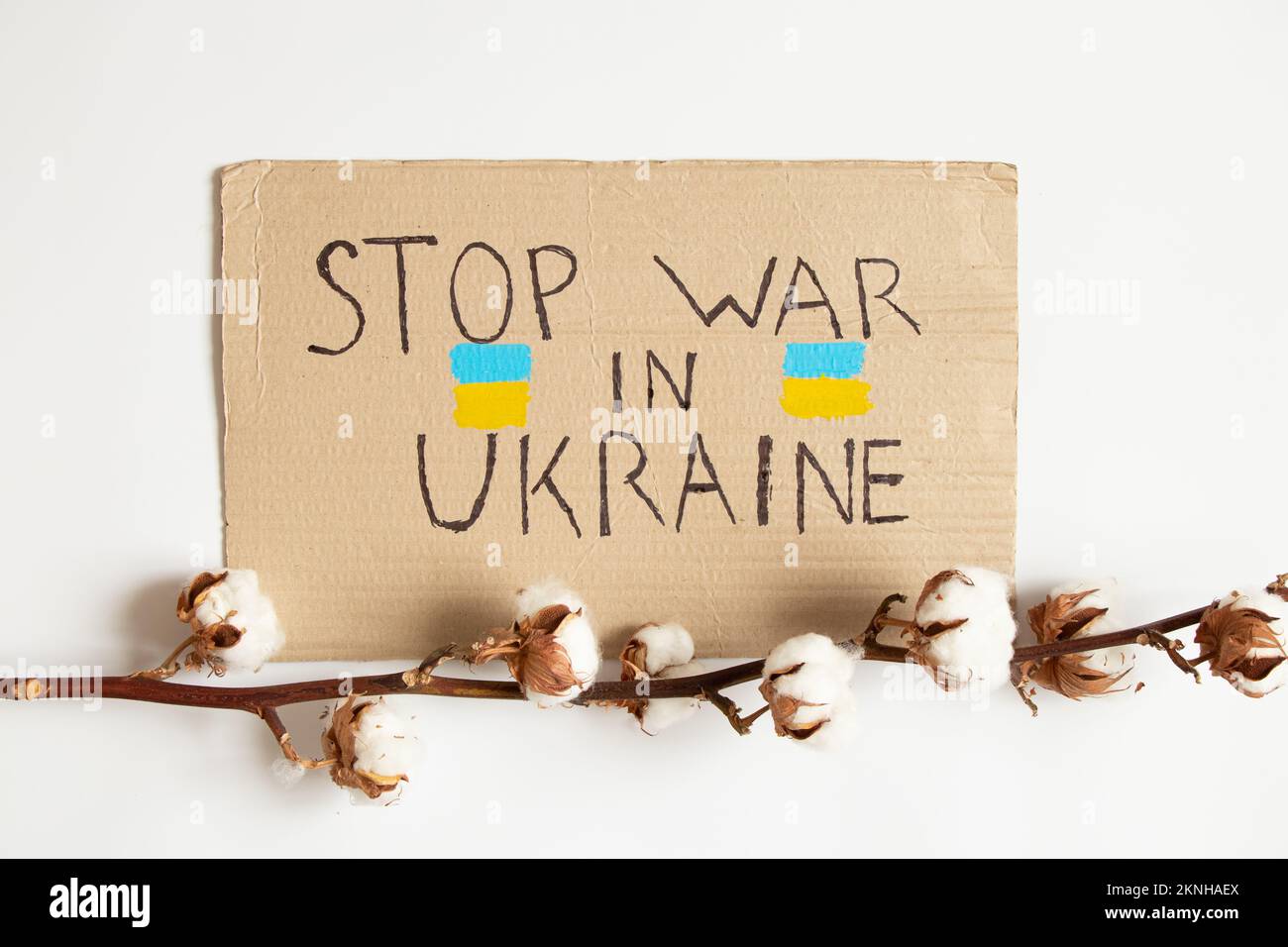 Stop the war in Ukraine is written on paper and next to it lies a ...