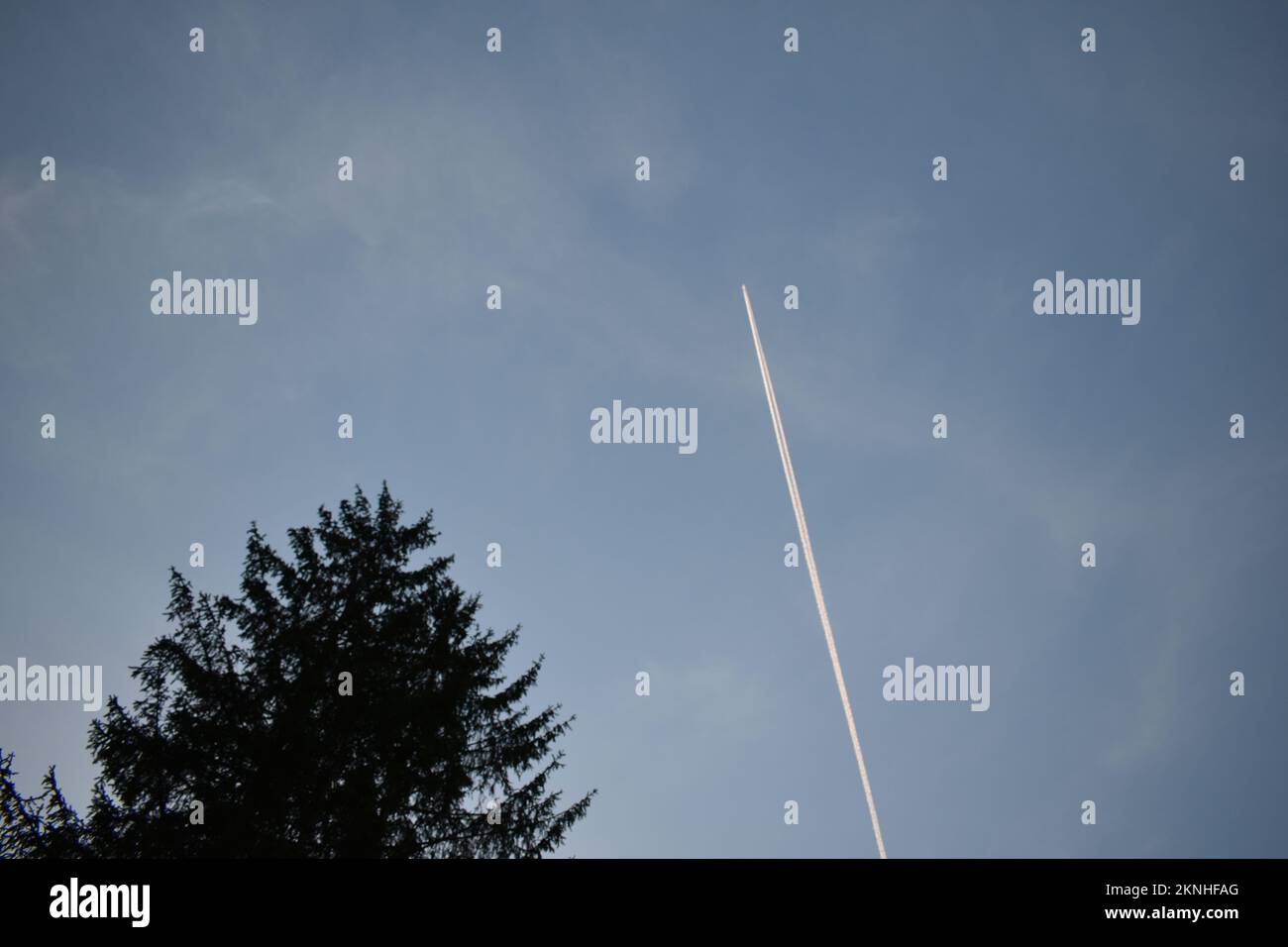 Sunset in the mountains as the plane is flying over Stock Photo - Alamy