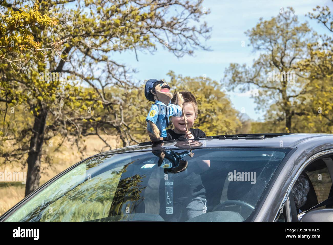 04-17-2020 Bartlesville USA - Young buy grins as he plays with a puppet ...