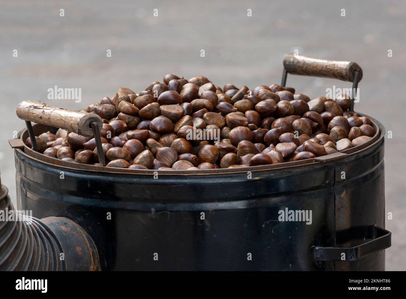 Roasted chestnuts at a street vendor during winter, traditional winter and Christmas snack Stock ...