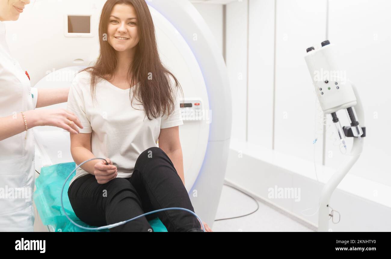 Female patient undergoing MRI - Magnetic resonance imaging in Hospital ...