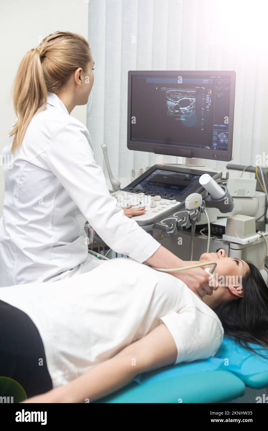 Smiling doctor, ultrasound. The doctor performed an ultrasound Stock ...