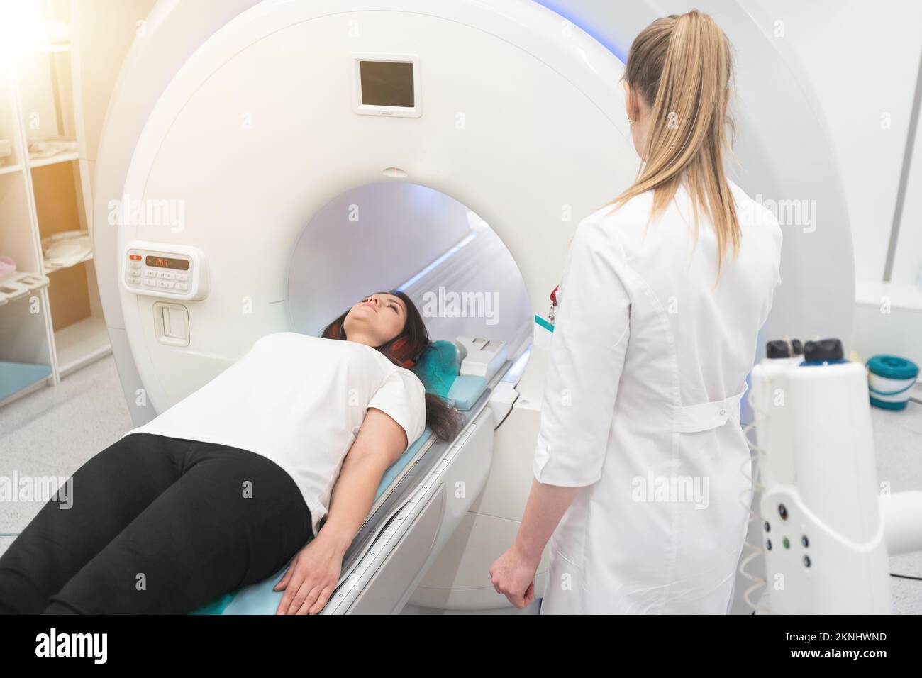 Female patient undergoing MRI - Magnetic resonance imaging in Hospital ...