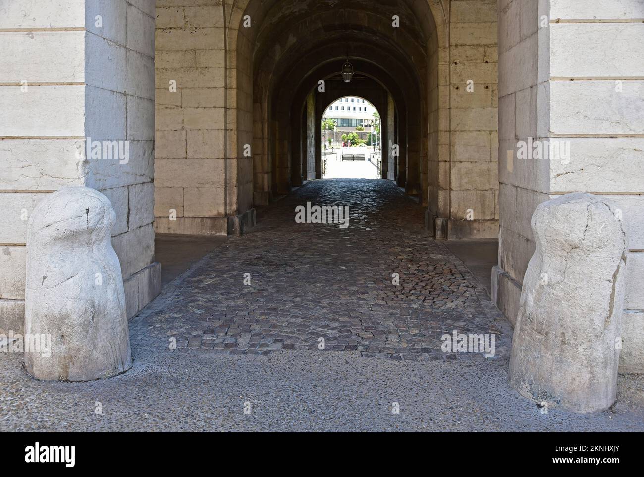 Corner protection stone bollards bearing traces of the passage bearing ...