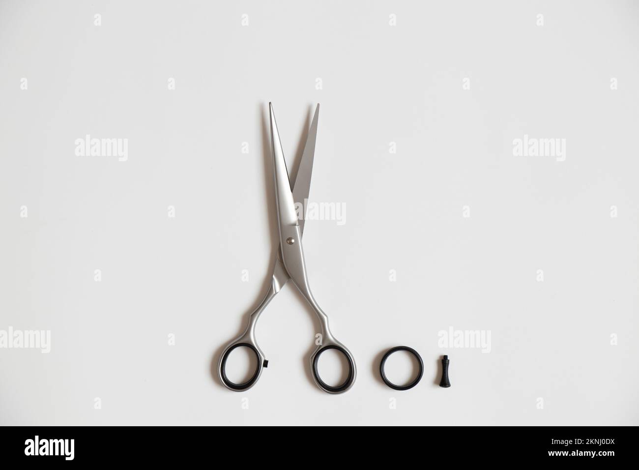 Professional scissors for cutting hair on a white background close-up ...
