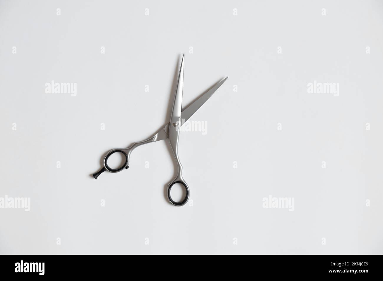 Professional scissors for cutting hair on a white background close-up ...