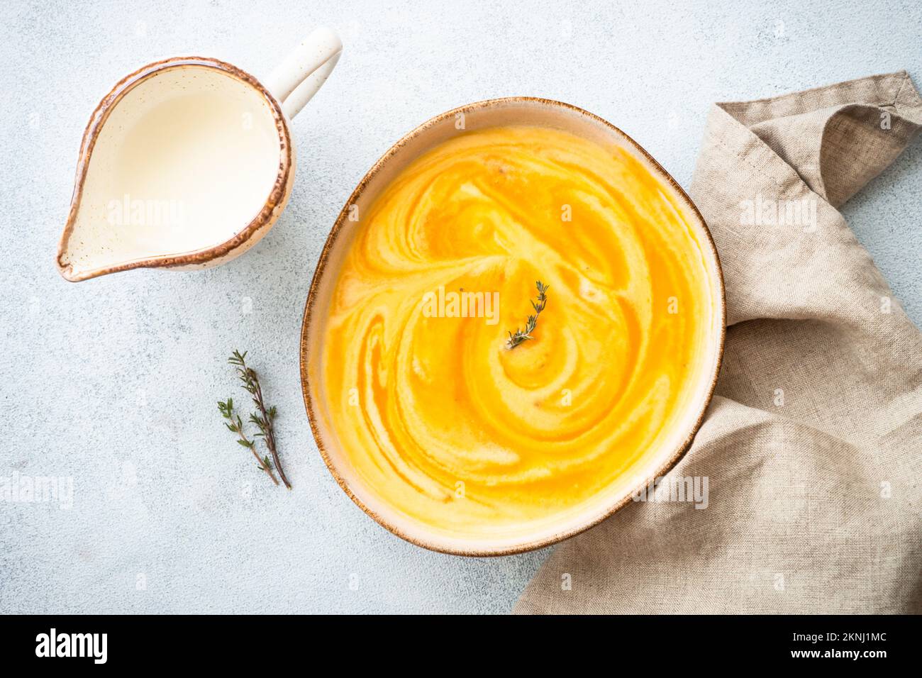 Pumpkin soup in the craft bowl at stone table Stock Photo - Alamy