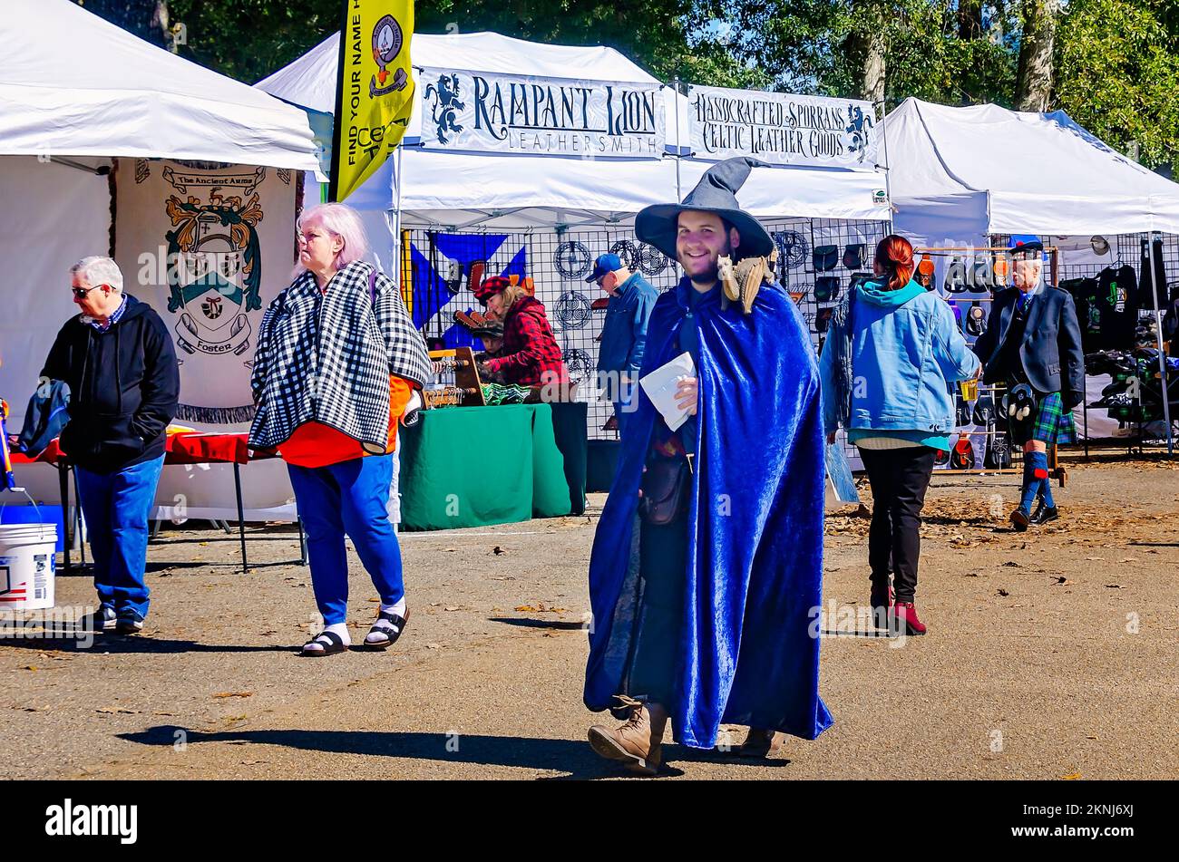 People walk past vendor booths during the annual Celtic Music Festival ...
