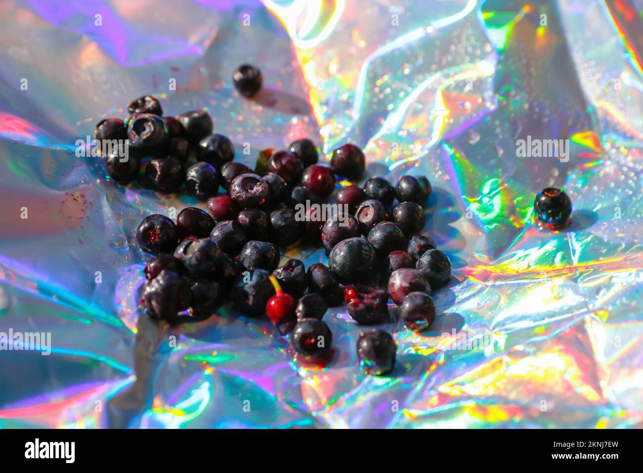 Defocus close-up group of dark blue wet blueberries and bilberries on ...