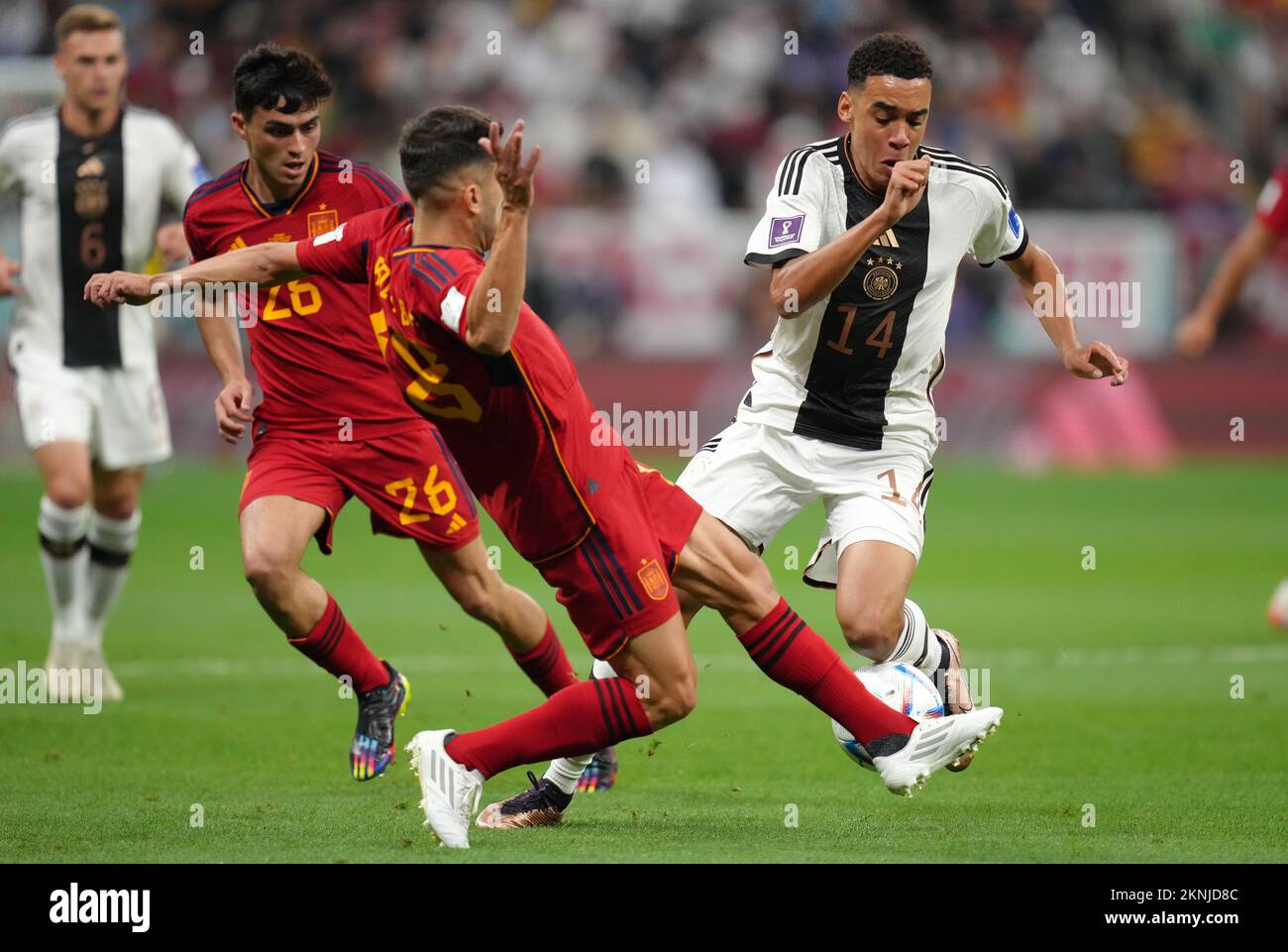 Spain's Jordi Alba (left) challenges Germany's Jamal Musiala during the ...