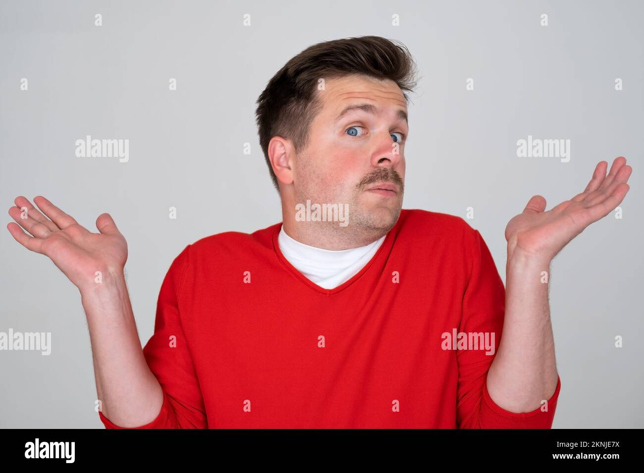 Man with arms outstretched looks to the camera doesn't know what to do ...