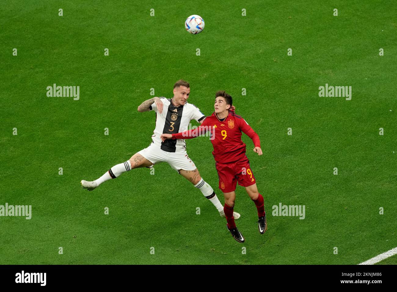 Germany’s David Raum (left) and Spain’s Gavi battle for the ball during ...