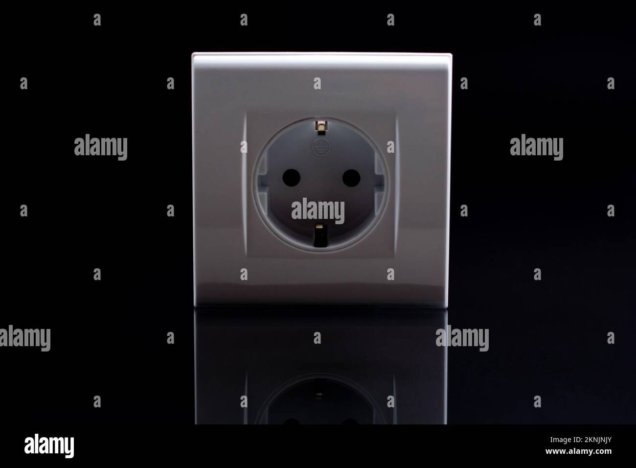 European white wall outlet, black background Stock Photo - Alamy