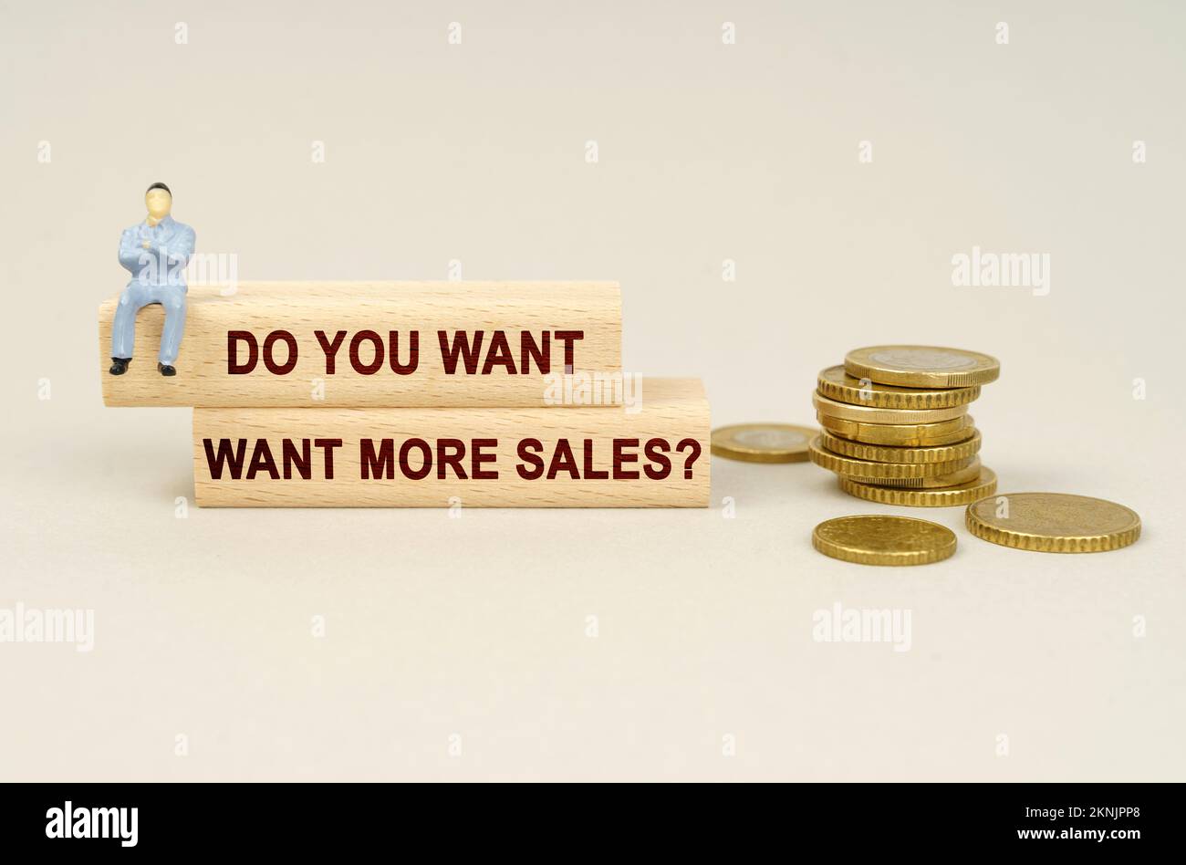 Business concept. On the table are coins, wooden plates with the ...