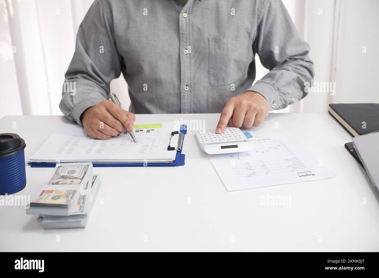 Unrecognisable businessman, accountant, banker calculating money at the ...