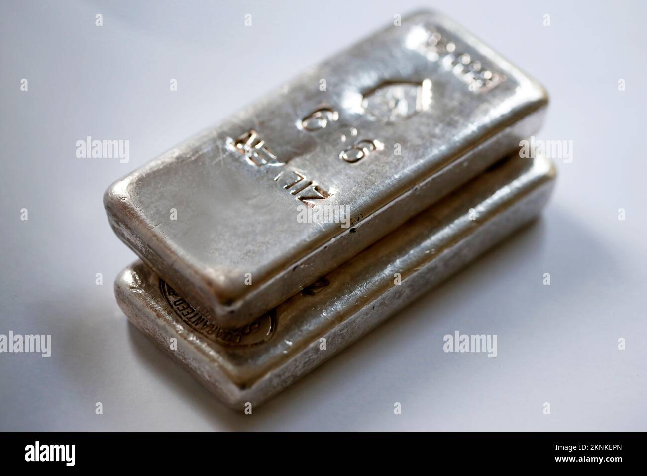 Silver ingots and a grey colored background Stock Photo - Alamy