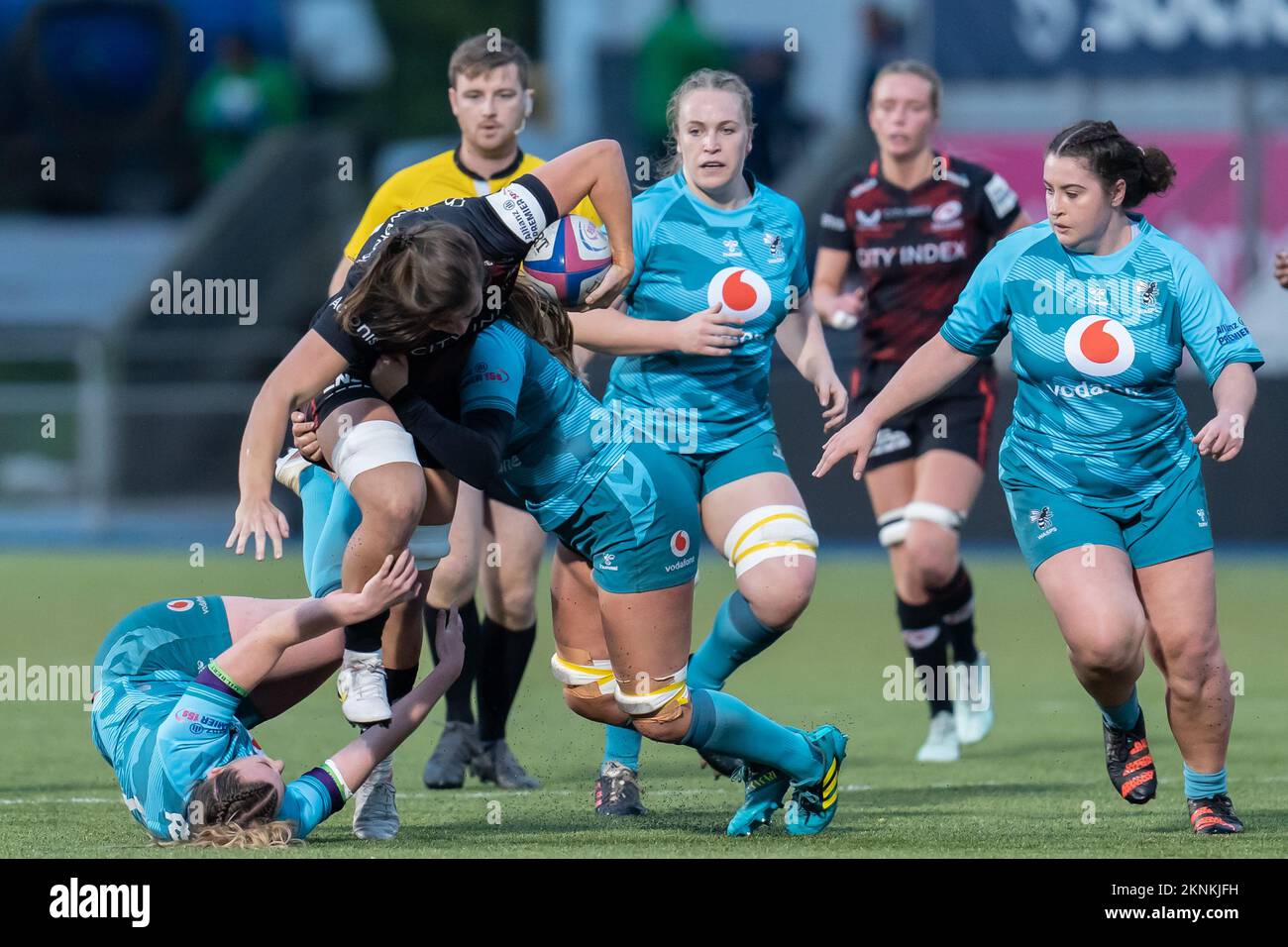 Louise McMillan #6 of Saracens Women powers her way the Wasps defence ...